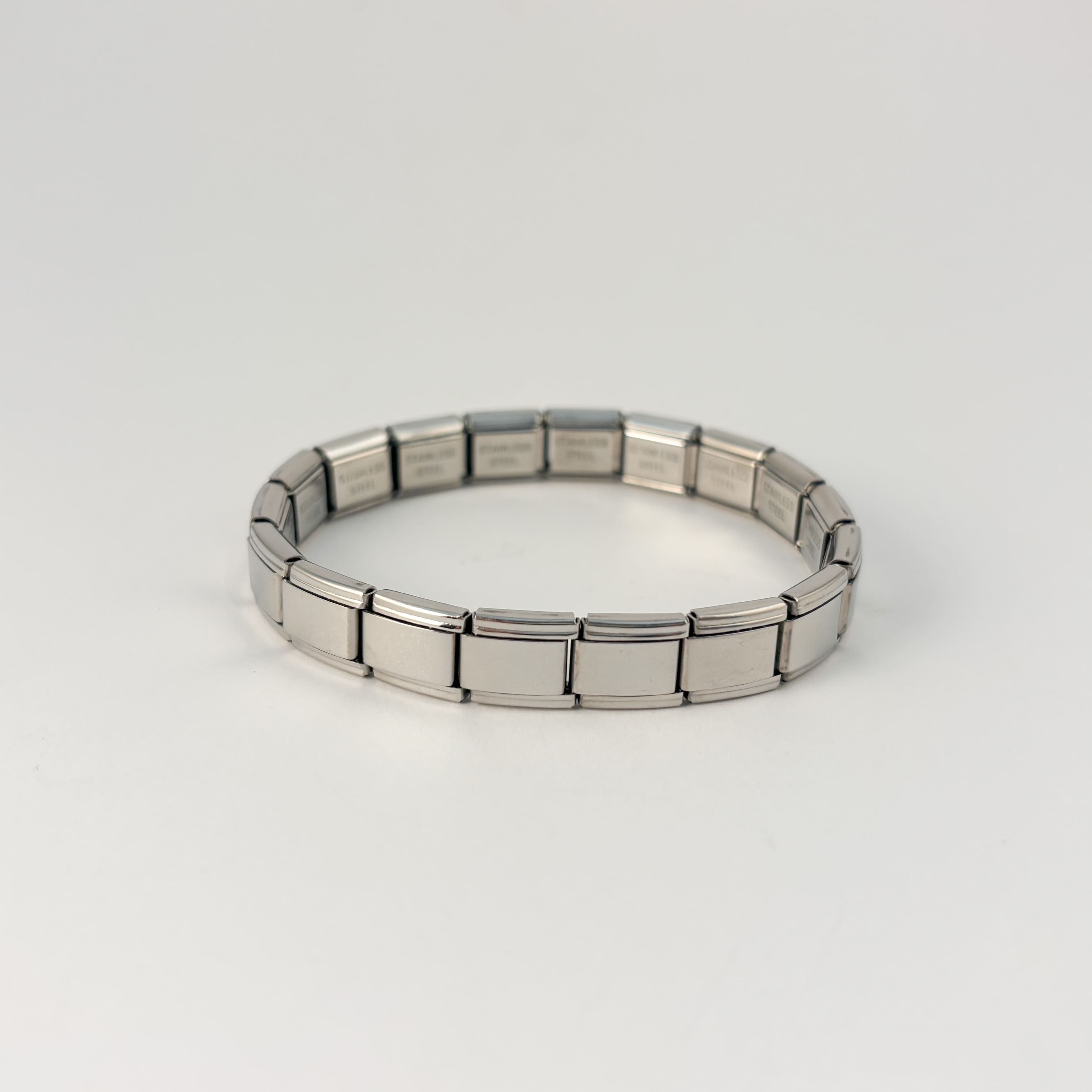 Pulsera italiana acero inoxidable 18 cuadritos plateada – Joyas Clover